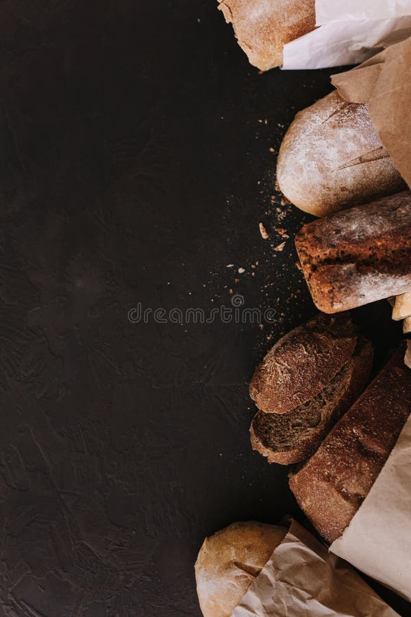 Various Crispy Bread and Buns on the Stone Table, Loaf of Fresh Baked ...