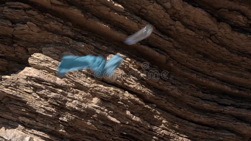 A Layered Cliff Exposing Various Geological Layers Next To a Body of ...