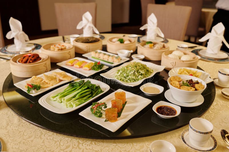 Various Dishes Serving on Round Table in the Restaurant Stock Photo ...