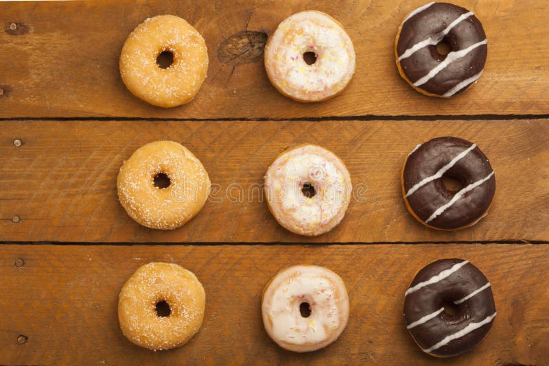 Various donuts on wood stock photo. Image of yummy, donut - 50483674