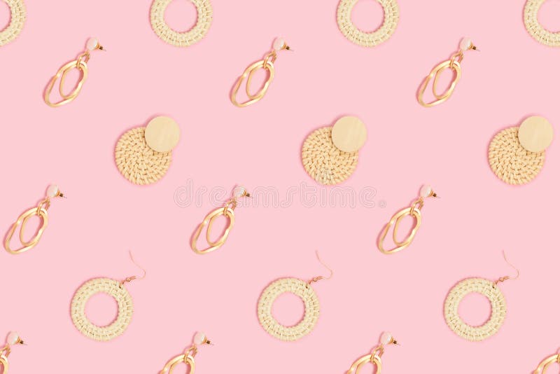 Various Earrings Pattern on a Pink Pastel Background. Stock Photo ...