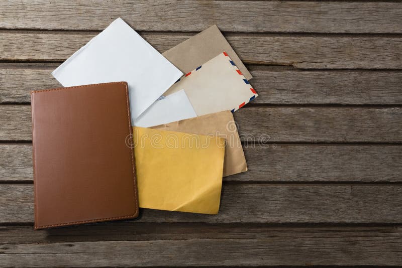 Various Envelopes and Diary on Wooden Plank Stock Photo - Image of ...