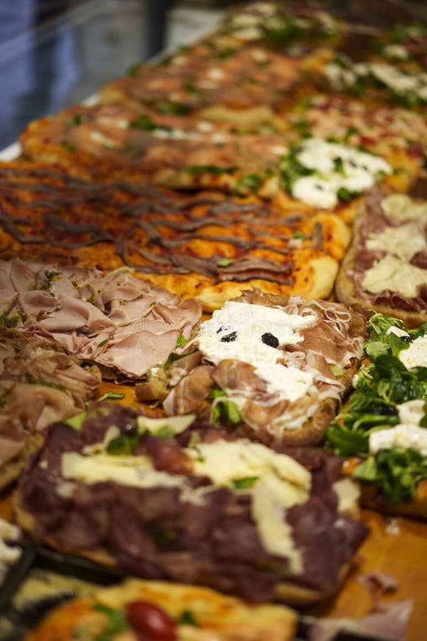 Various Flavors Pizza Cut into Square Slices Stock Photo - Image of ...