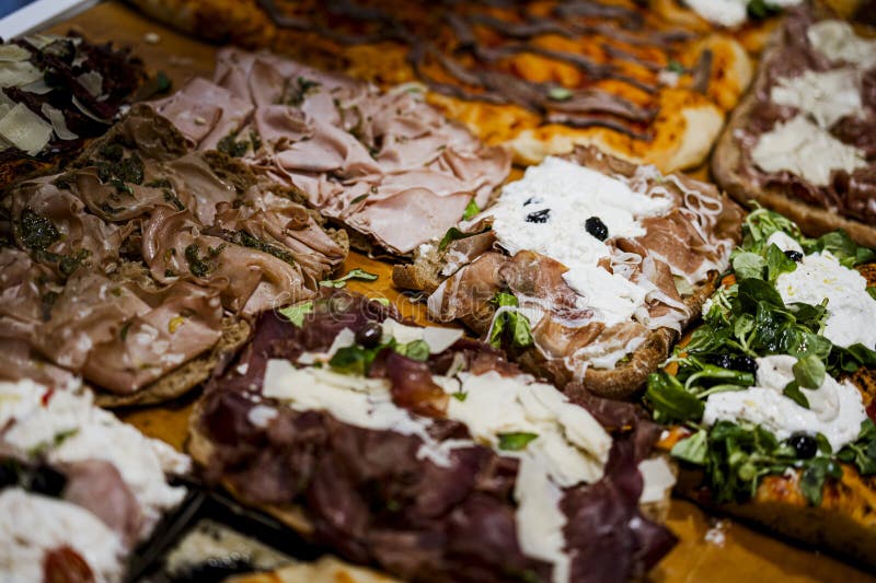 Various Flavors Pizza Cut into Square Slices Stock Photo - Image of ...