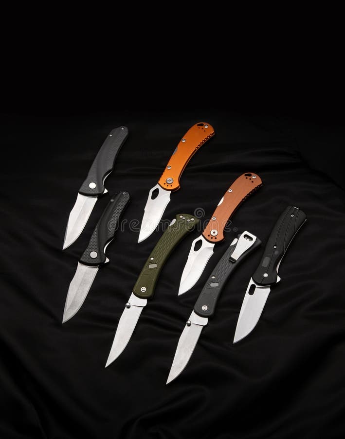 Various Folding Pocket Knives on a Dark Back. a Versatile Pocket Tool ...