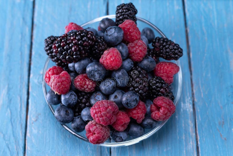 Various Forest Berries in a Glass Plate. Multi-colored Berries in a ...