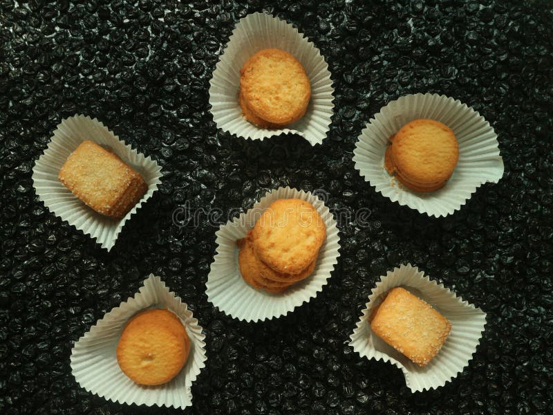 Various Forms of Cookies Contain Butter Inside the Cupcake Paper. Stock ...