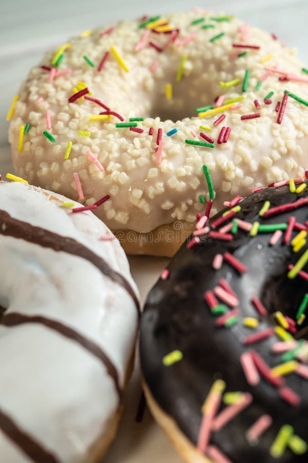 Various Fresh Baked Donuts on a Wooden Background Stock Photo - Image ...
