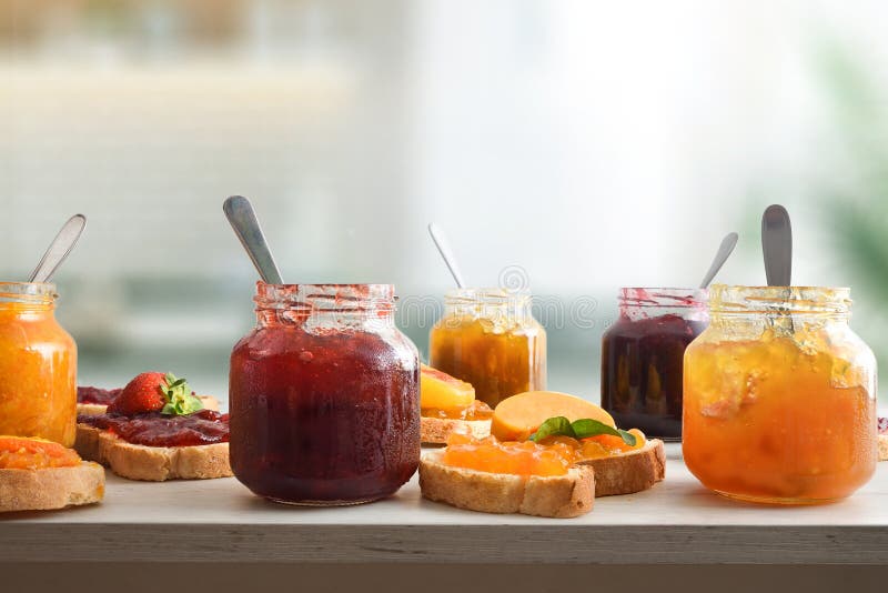 Various Fruit Jams and Toast on Table in a Kitchen Stock Photo - Image ...