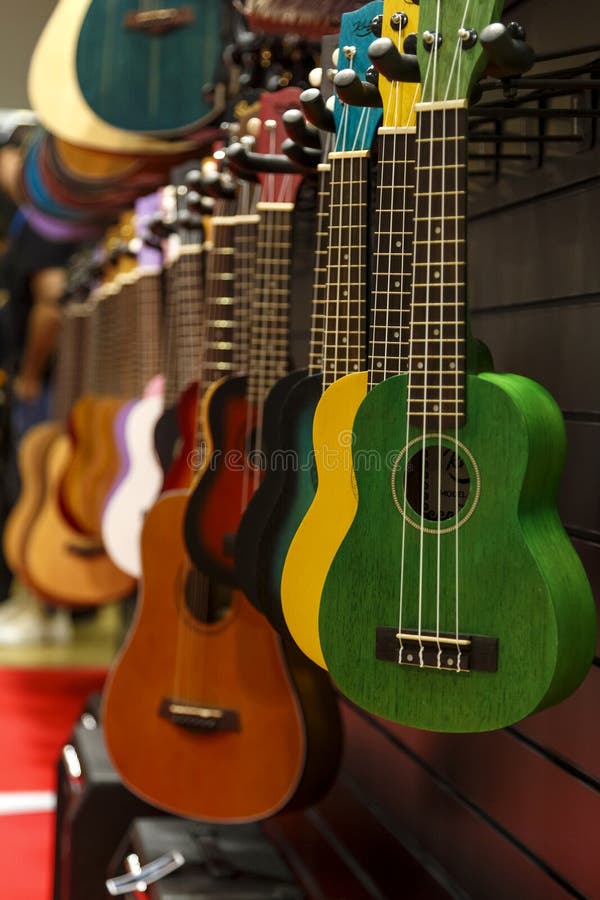 Various Guitars of Different Models Hang in the Store for Sale Stock ...