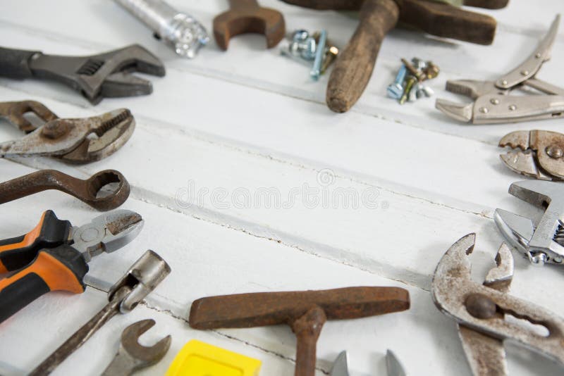 Various Hand Tools Arranged on White Table Stock Image - Image of iron ...