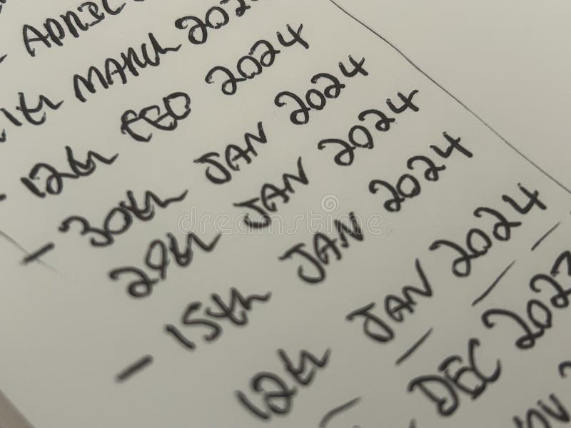 Various Hand Written Dates on a Plain Piece of Paper Stock Image ...