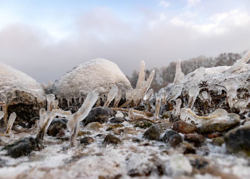 Various Ice Formations on Rocks and Sandbars on the Seashore, Ice ...