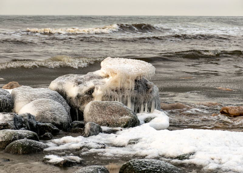 Various Ice Formations on Rocks and Sandbars on the Seashore, Ice ...