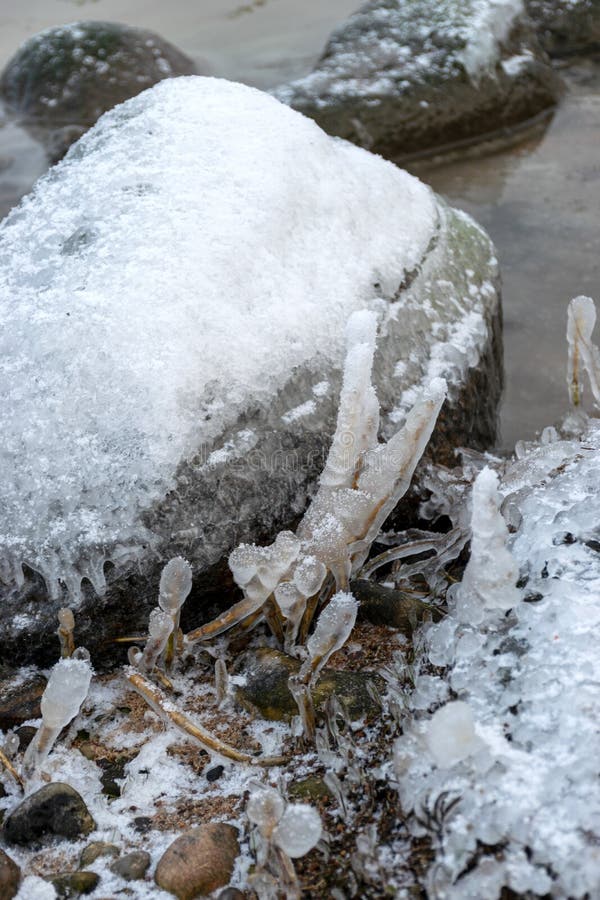 Various Ice Formations on Rocks and Sandbars on the Seashore, Ice ...