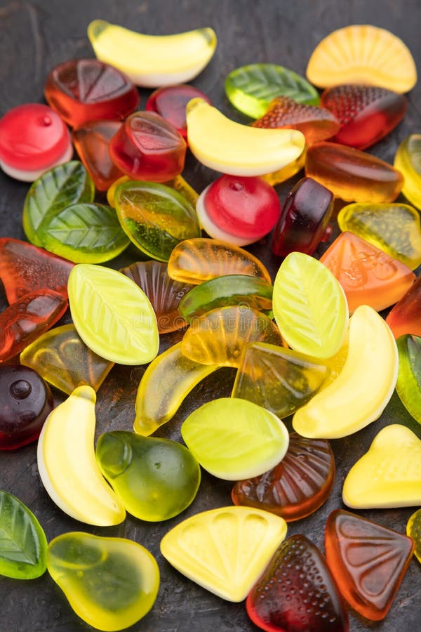 Various Jelly Candies on Black Concrete Background. Close Up, Side View ...
