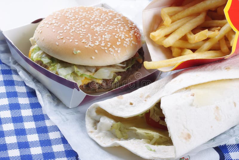 Various junk food on table stock photo. Image of unhealthy - 12983488