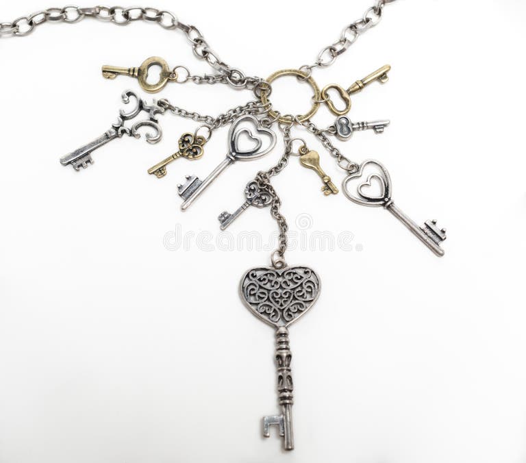 Various Keys Attached To a Chain on White-grey Isolated Background ...