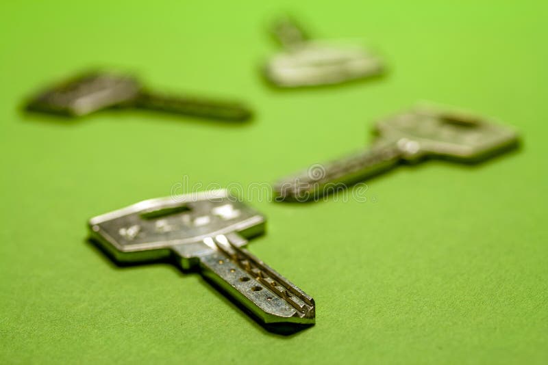 Various Keys on Green Background Stock Photo - Image of metal, property ...