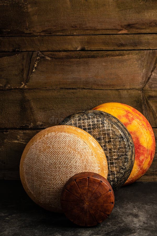 Various Kind of Cheese. Head of Handcrafted Hard Cheese on a Dark ...