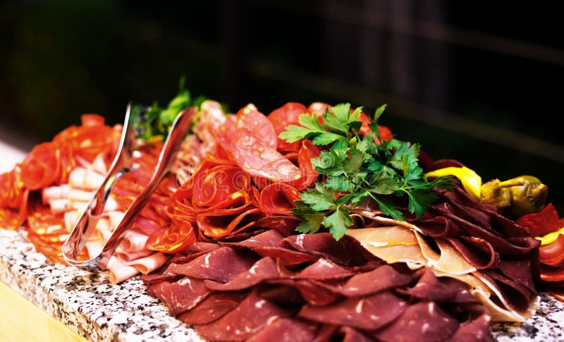 Various Kinds of Sliced Salami on the Plate Stock Photo - Image of ...
