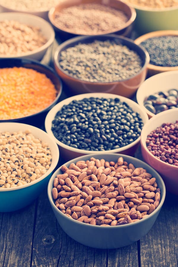 Various legumes in bowls stock image. Image of heap, seed - 60724807