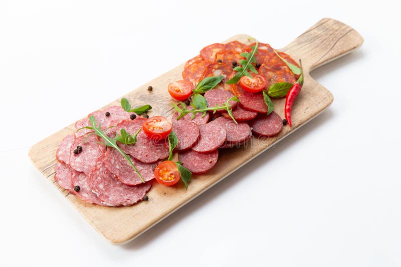 Various Meat Snacks on the Board. on White Background Stock Photo ...
