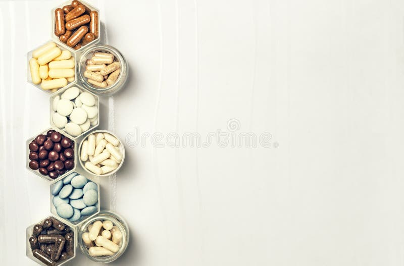 Various Medical Capsules and Tablets in Hexagonal Jars Stock Image ...