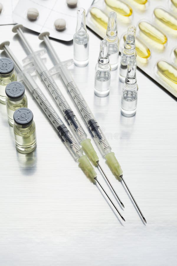 Various Medications As Injections and Tablets on Steel Background Stock ...