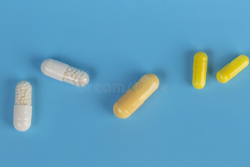 White and Yellow Medicinal Tablets and Capsules Stock Image - Image of ...