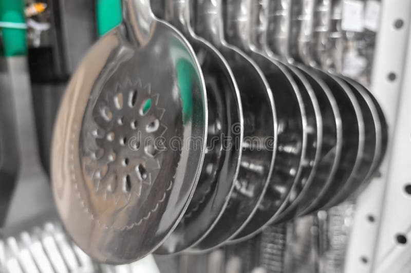 Shiny Kitchen Utensils Hang Neatly in a Culinary Store Display Stock ...