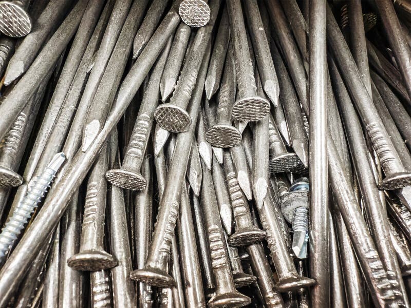 Various Metallic Nails and Screws Piled Together in a Close-up View ...