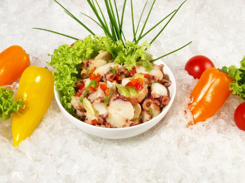 Various Mini Peppers and Octopus Salad on Ice with White Background ...
