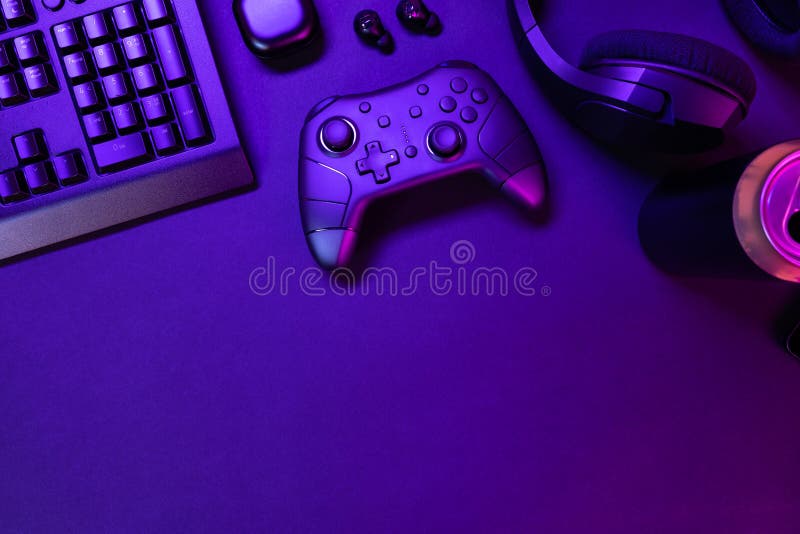Controller with Purple Lit Keyboard Amidst Various Wireless Devices ...