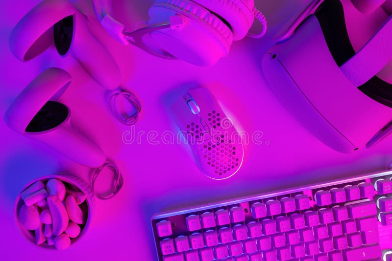 Various Modern Gaming Gadgets on Purple Desk Stock Image - Image of ...