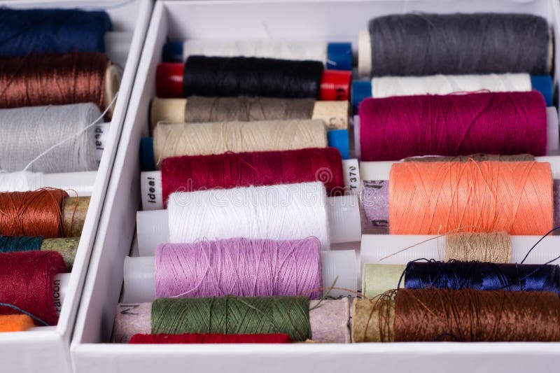 Various Multicolored Used Sewing Threads in a Box, Stacked in a Stock ...