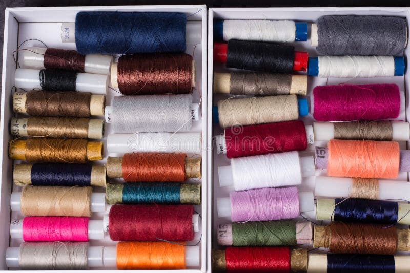 Various Multicolored Used Sewing Threads in a Box, Stacked in a Stock ...
