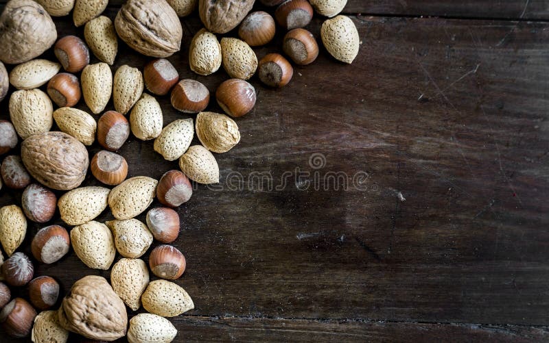 Various Nuts Placed on a Wooden Table Stock Image - Image of season ...