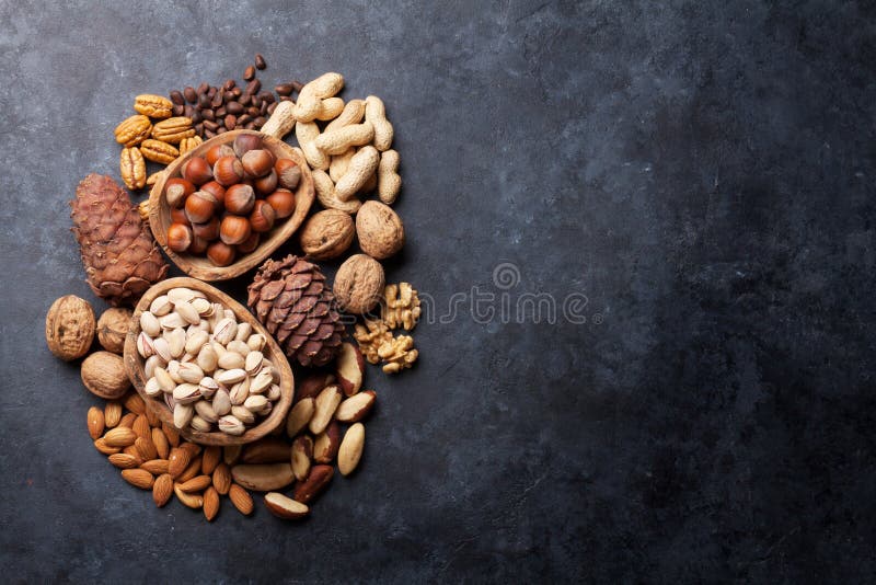 Various Nuts on Stone Table Stock Image - Image of pinecone, nuts: 82292729