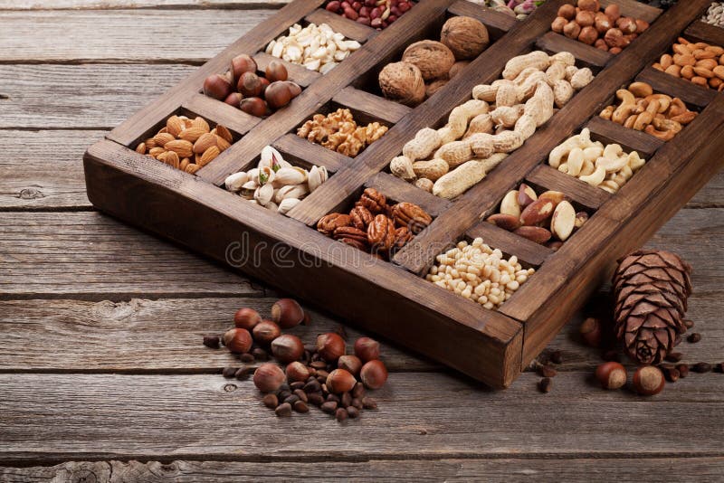 Various nuts in wooden box stock image. Image of natural - 107320211