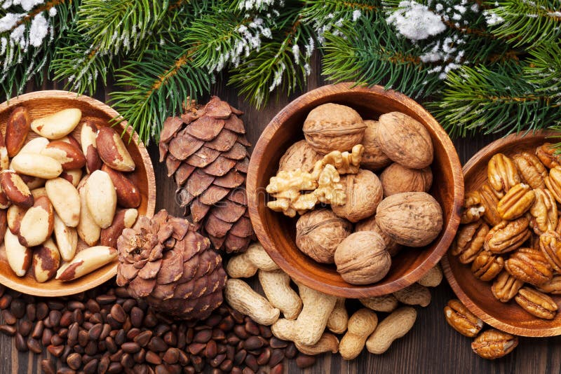Various Nuts on Wooden Table Stock Photo - Image of closeup, assorted ...