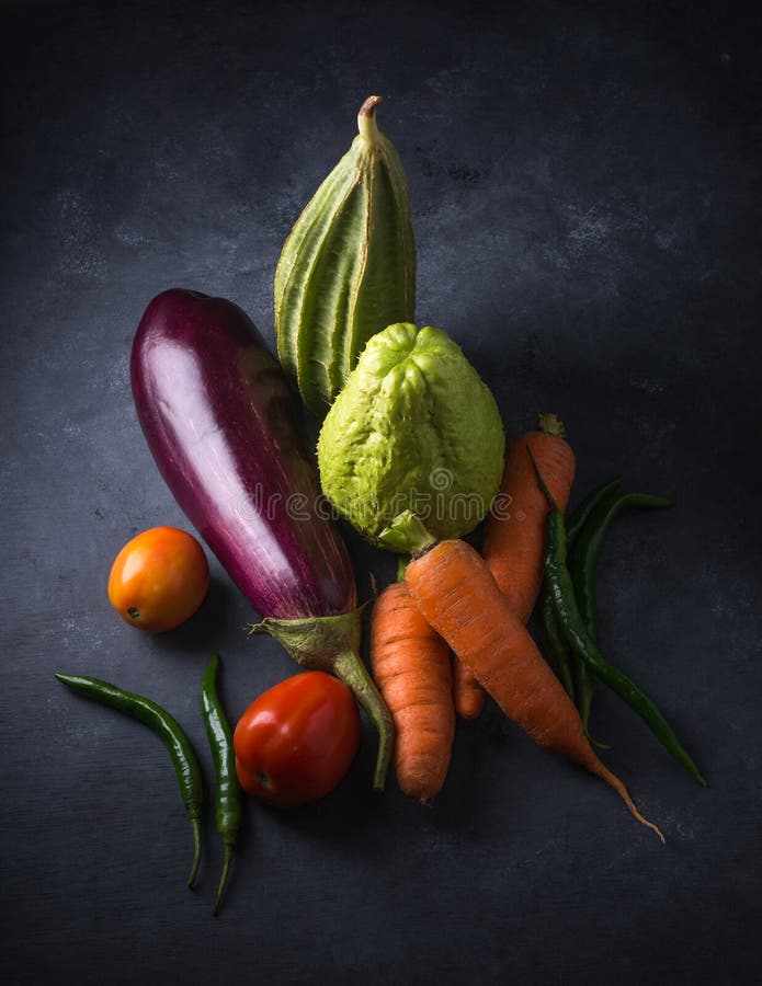 Various Organic Vegetables on a Dark Textured Surface, Taken from Above ...