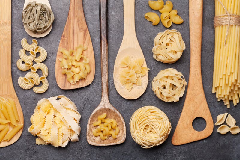 Various pasta in spoons stock photo. Image of ingredients - 165050640