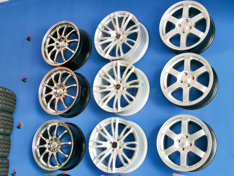Various Pattern New Car Rims Hanging on the Concrete Wall. Stock Image ...