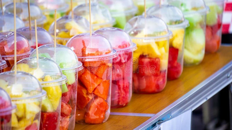 Various Pieces of Fruit in Plastic Cups. Healthy Food for People Stock ...