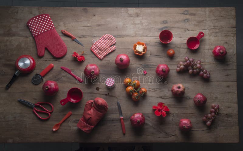 Various Red Objects on a Wooden Table Stock Image - Image of grapes ...