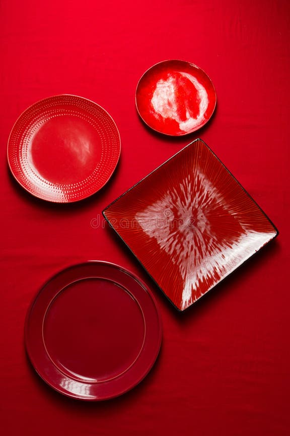 Various Red Plates on a Red Tablecloth on the Table Stock Photo - Image ...