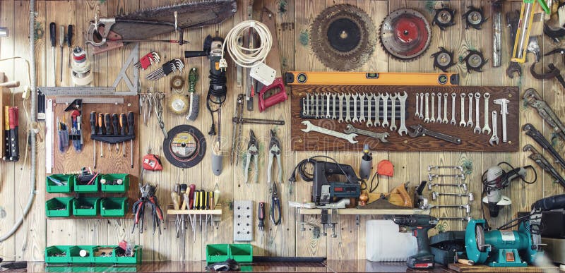 Various Tools Hang on a Wooden Wall in a Workshop Stock Image - Image ...