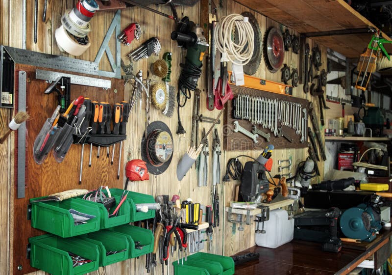 Various Tools Hang on a Wooden Wall in a Workshop Stock Image - Image ...
