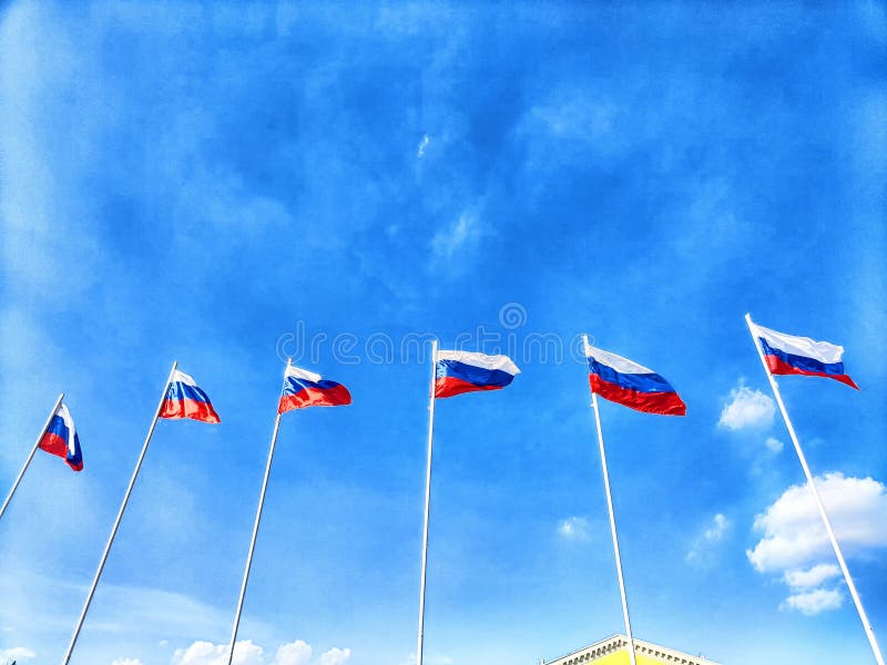 Various Russian Flags are Flying High Against a Brilliant Blue Sky ...